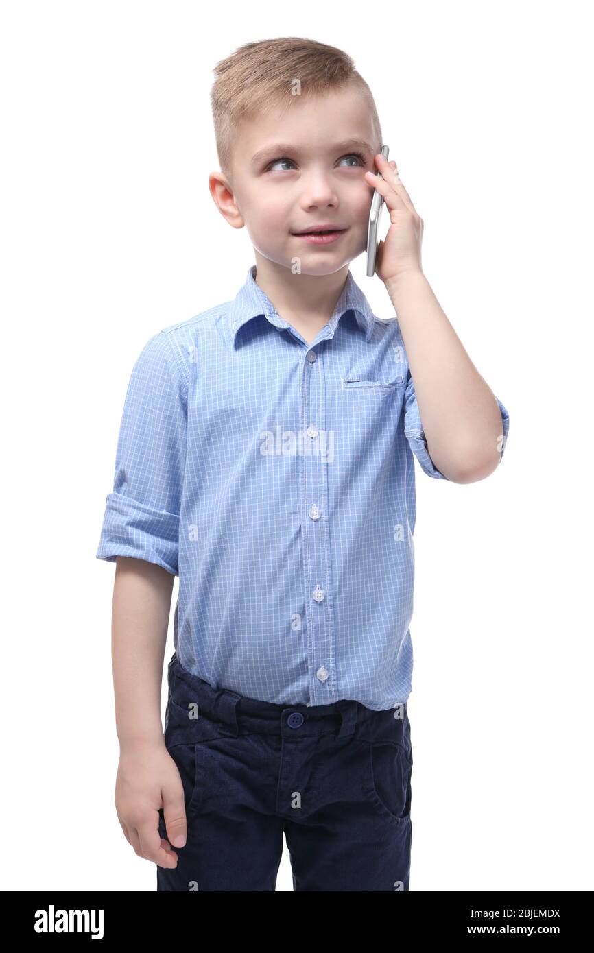 Cute little boy talking by mobile phone on white background Stock Photo ...