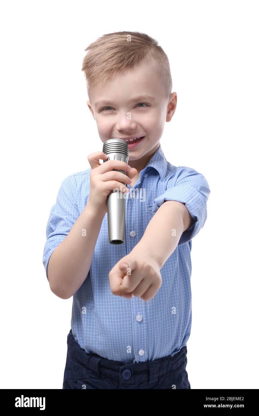 Cute little boy with microphone on white background Stock Photo - Alamy