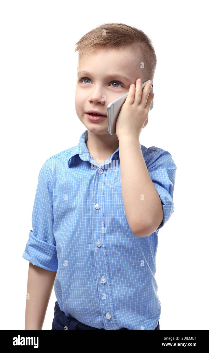 Cute little boy talking by mobile phone on white background Stock Photo ...