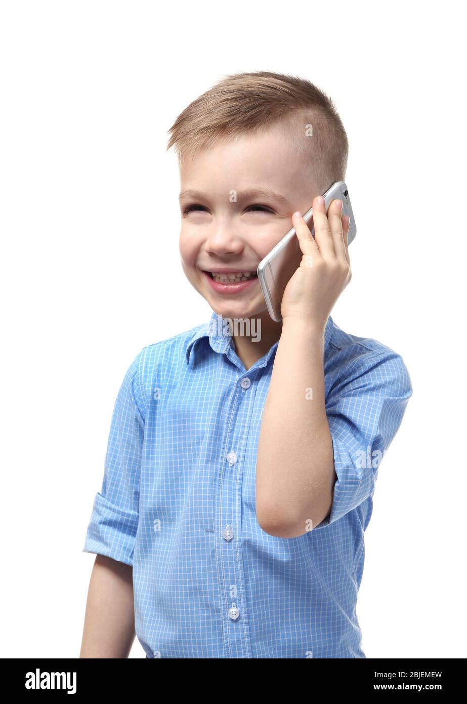 Cute little boy talking by mobile phone on white background Stock Photo ...