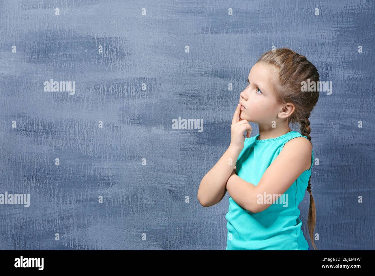 Cute little girl on color background Stock Photo - Alamy