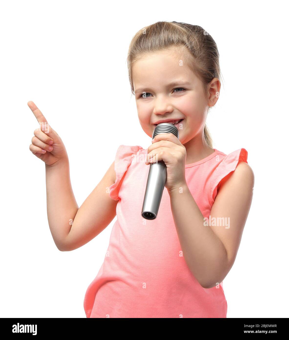 Cute little girl with microphone on white background Stock Photo - Alamy
