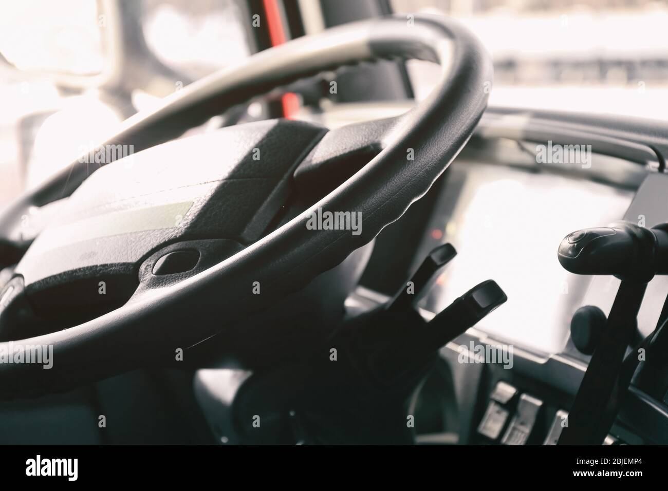 Steering wheel in cabin of big truck, closeup Stock Photo - Alamy