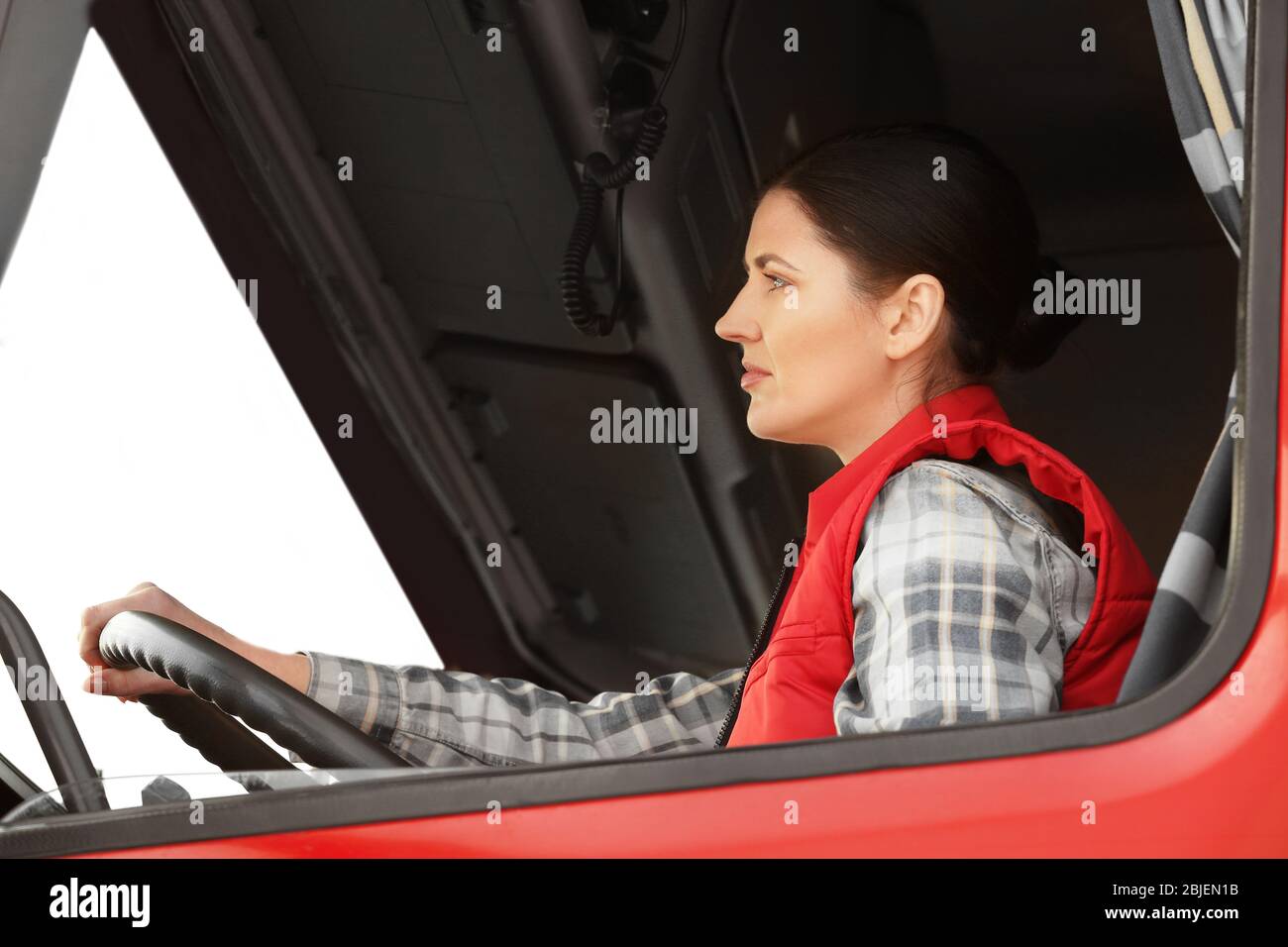 Young woman driving big modern truck Stock Photo - Alamy