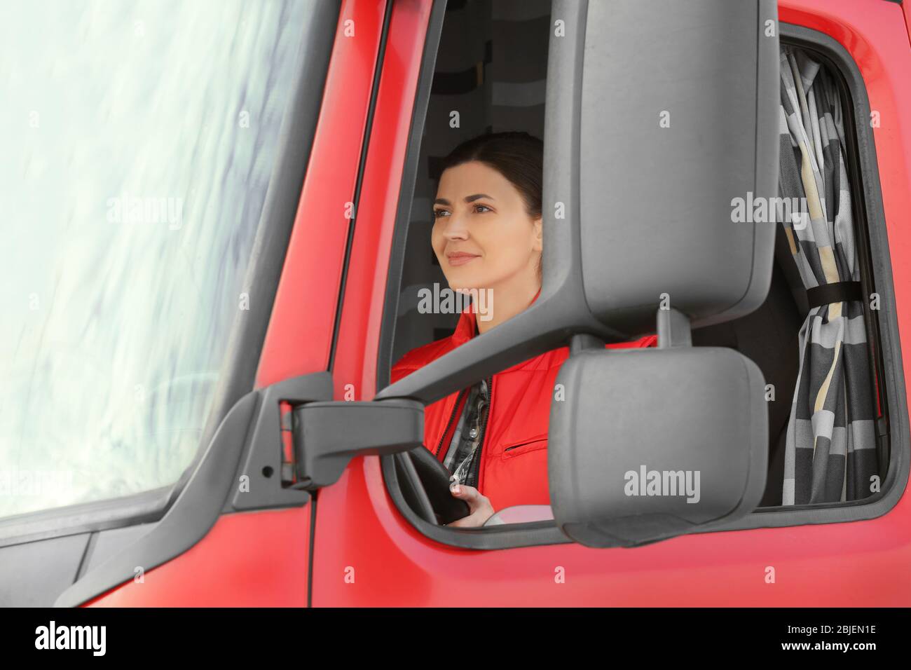 Female driving cargo truck hi-res stock photography and images - Alamy