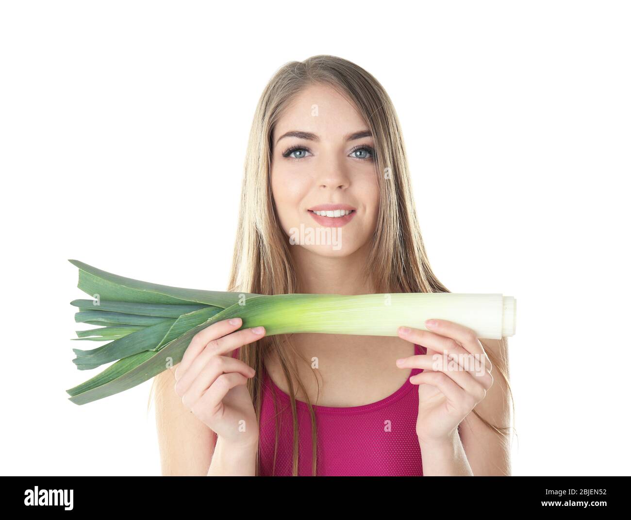 Young beautiful woman holding leek on white background Stock Photo - Alamy