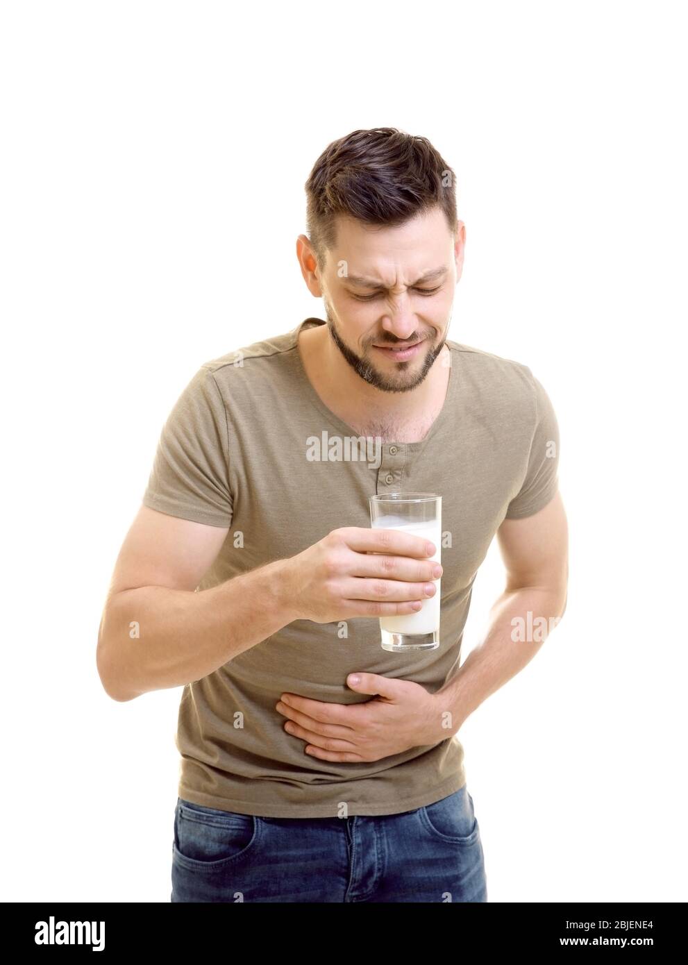 Man with milk allergy on white background Stock Photo - Alamy