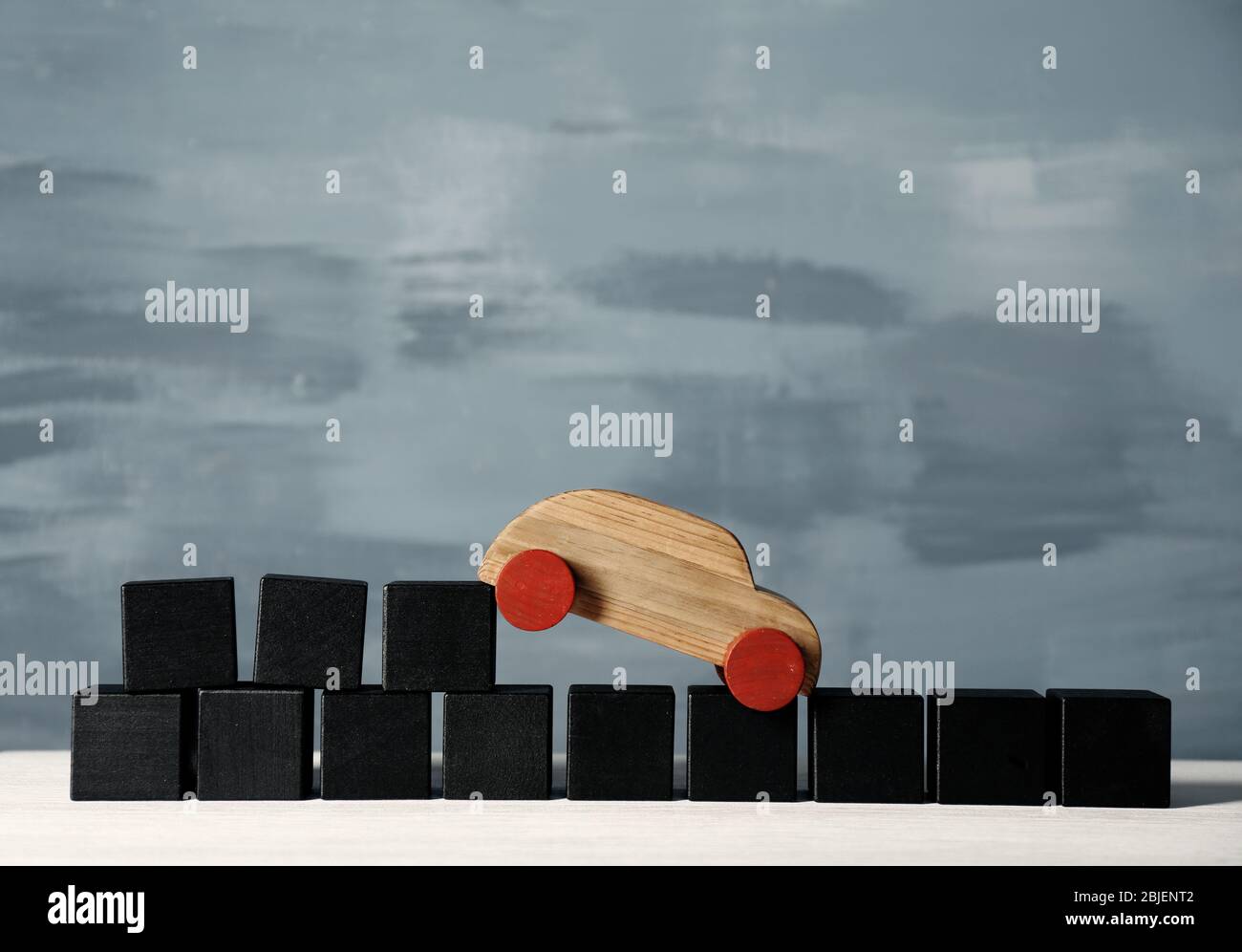 Car insurance concept. Toy and wooden cubes on colour background Stock ...