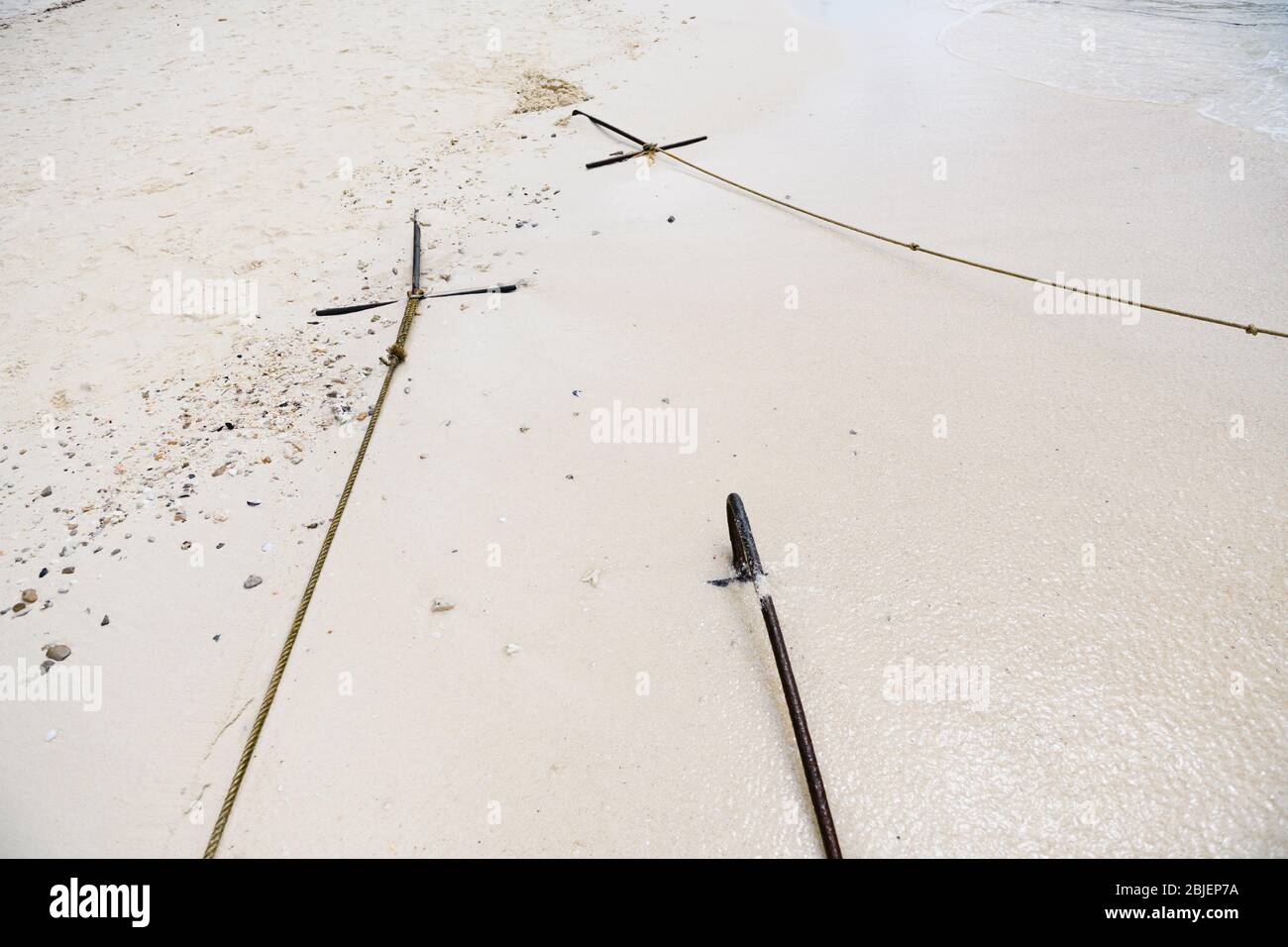 Rope buried in sand hi-res stock photography and images - Alamy