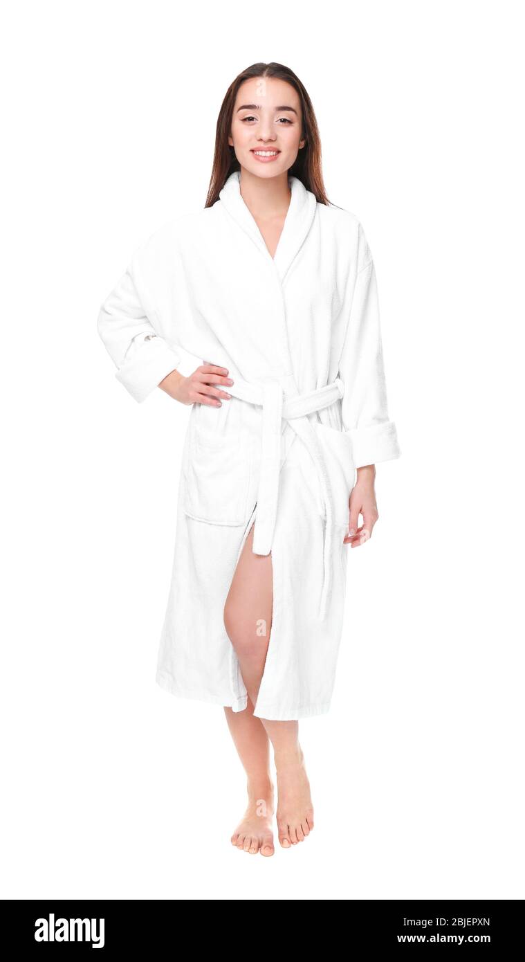 Beautiful young woman in bathrobe on white background Stock Photo - Alamy