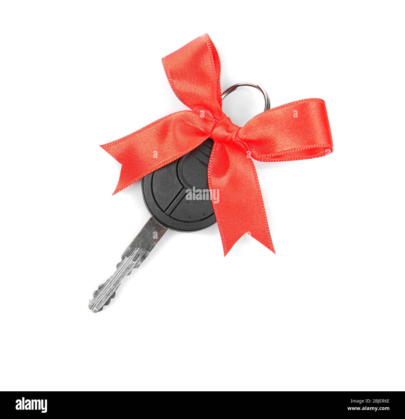 Car key with red bow isolated on white Stock Photo - Alamy