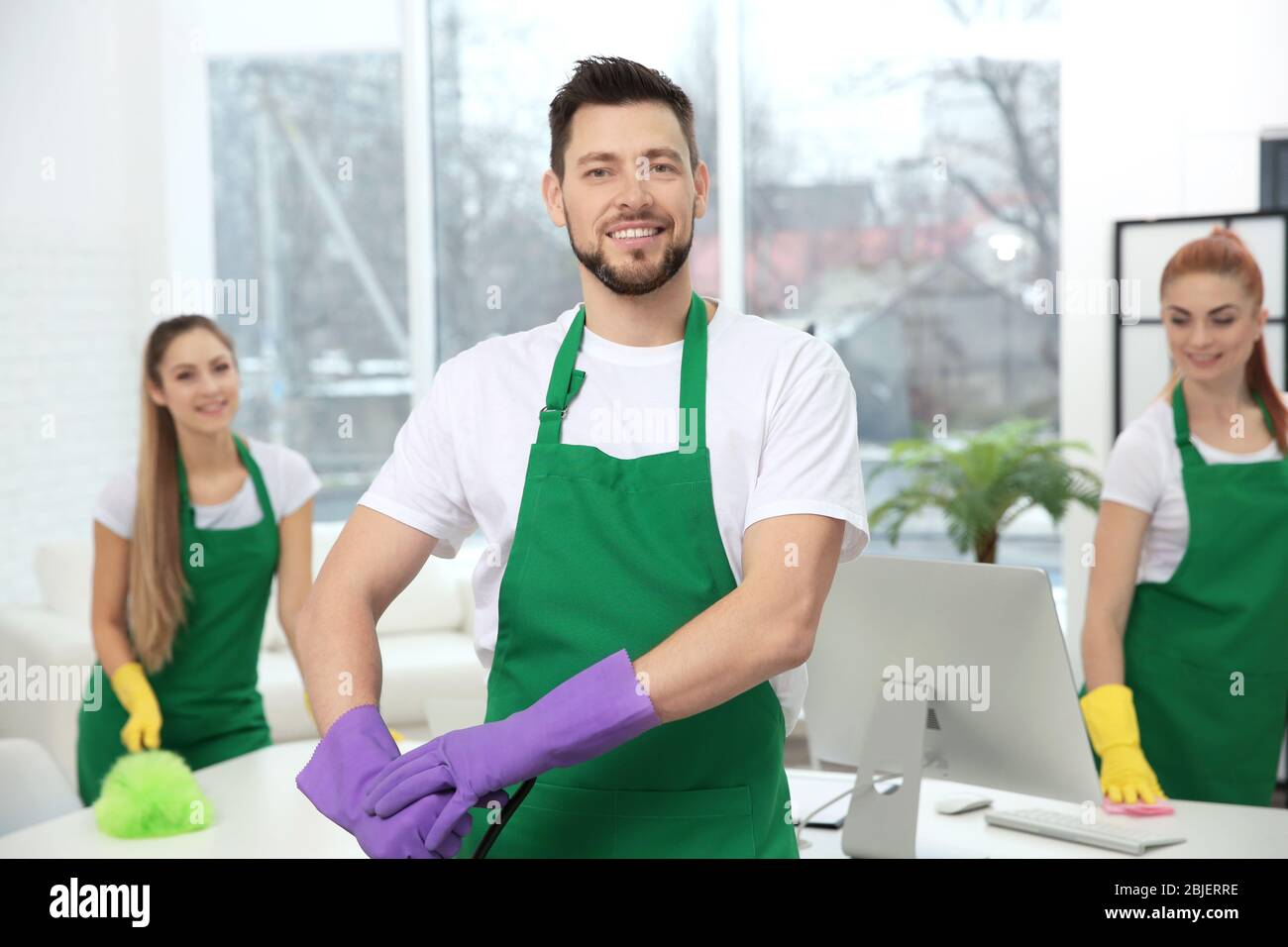 Male house cleaner in uniform hi-res stock photography and images - Alamy