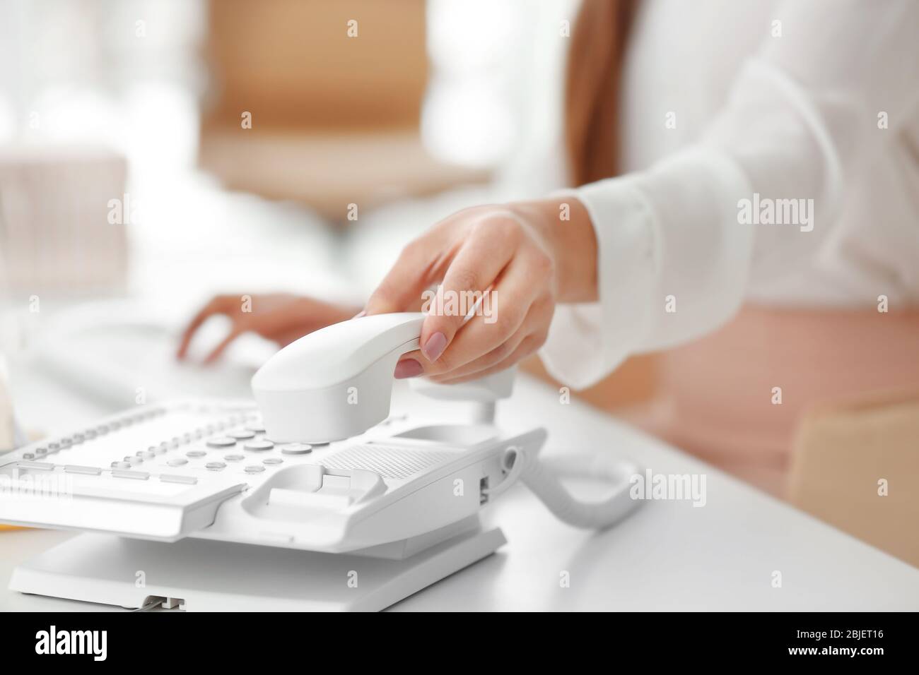 Female hand picking up telephone hi-res stock photography and images ...
