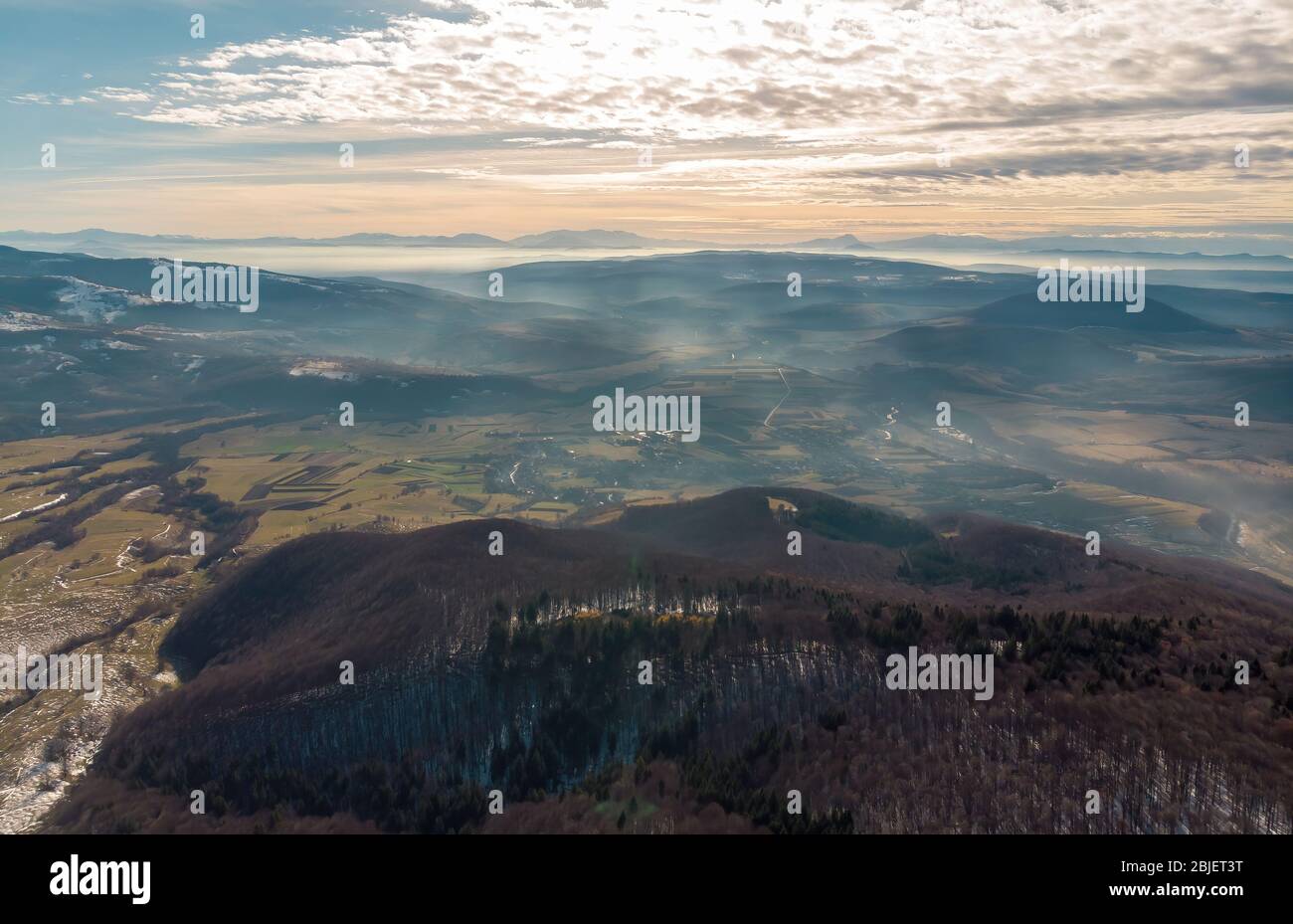 Aerial view of Carpathian Mountains with fog in Romania at sunset Stock ...