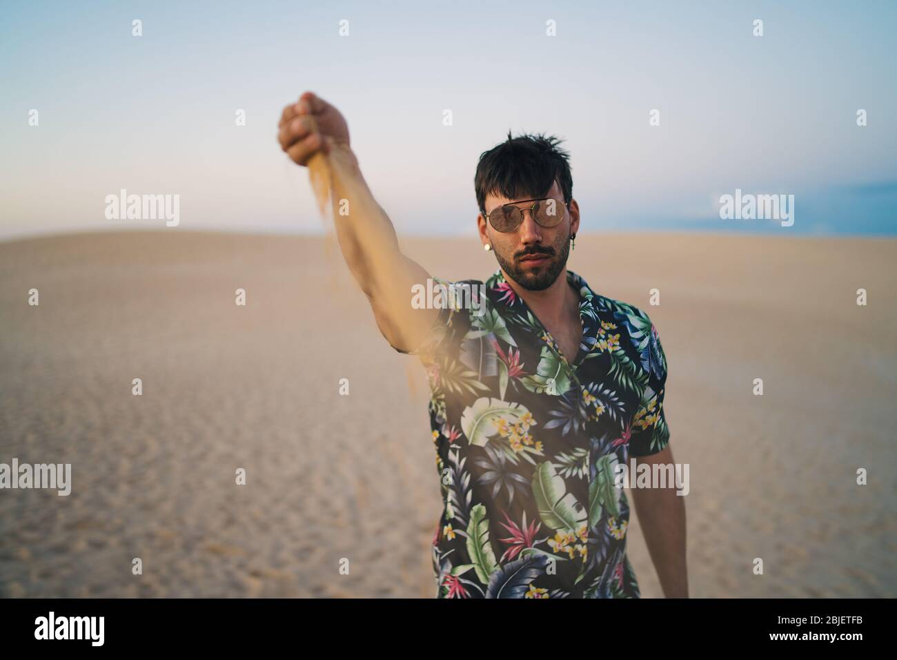 Sand falling through hands hi-res stock photography and images - Alamy