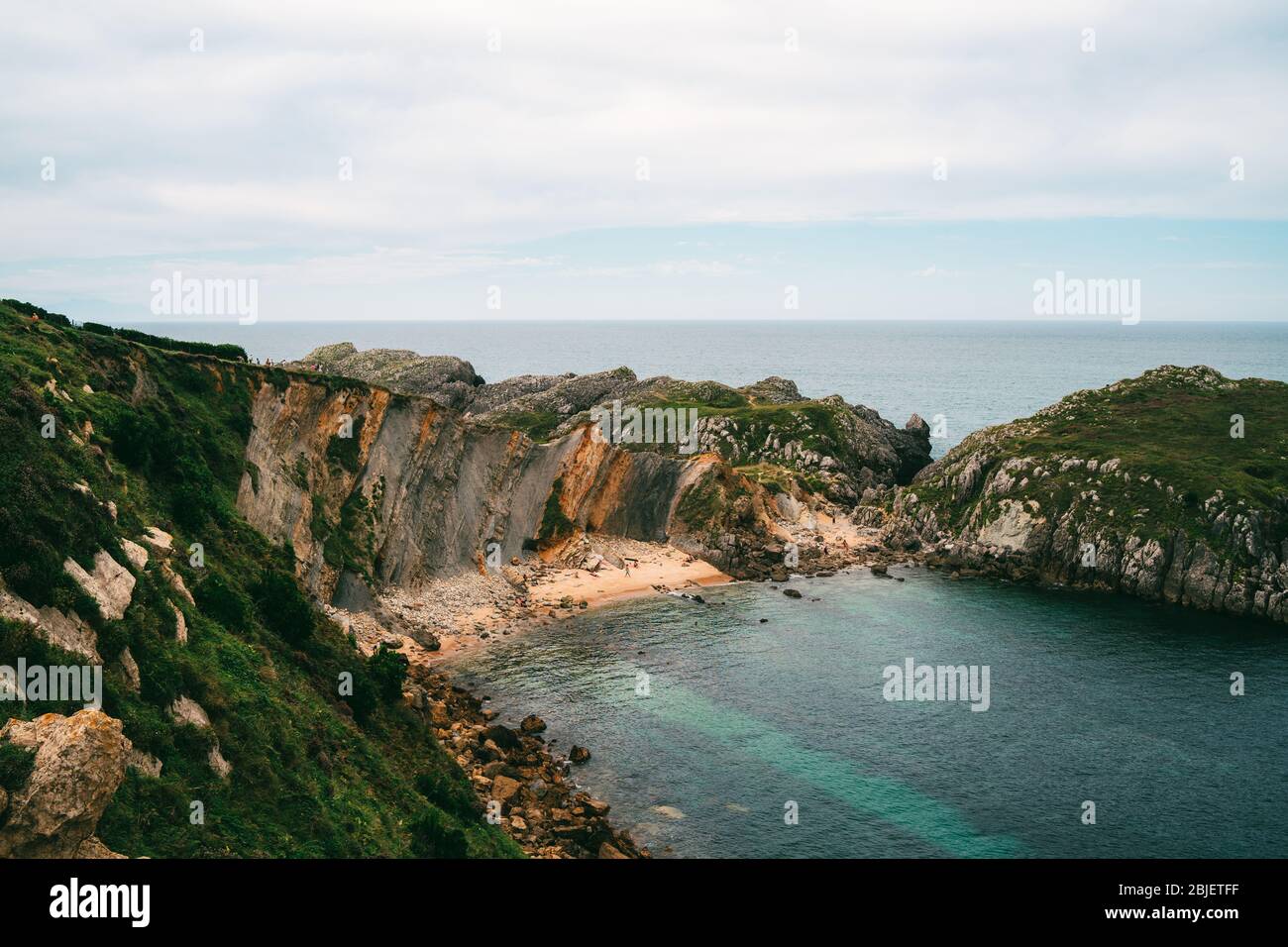 Aerial shot of beautiful spanish beach with turquoise water and rocky ...