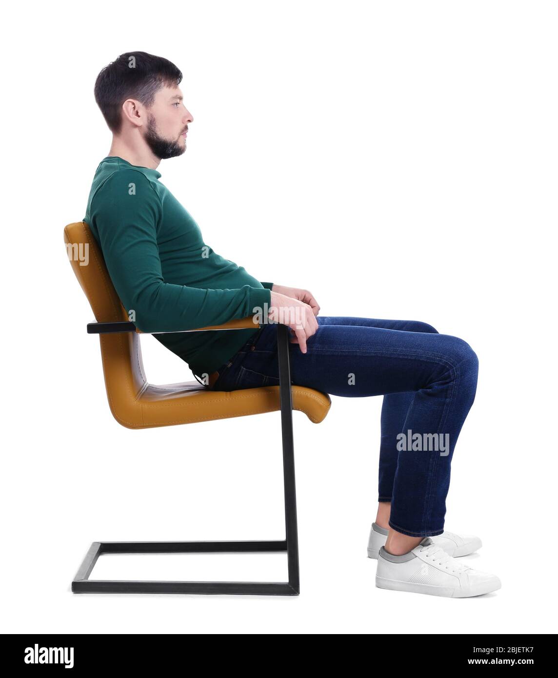 Posture concept. Man sitting in armchair on white background Stock ...