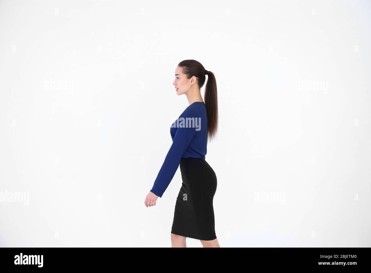 Posture concept. Young woman on white background Stock Photo - Alamy