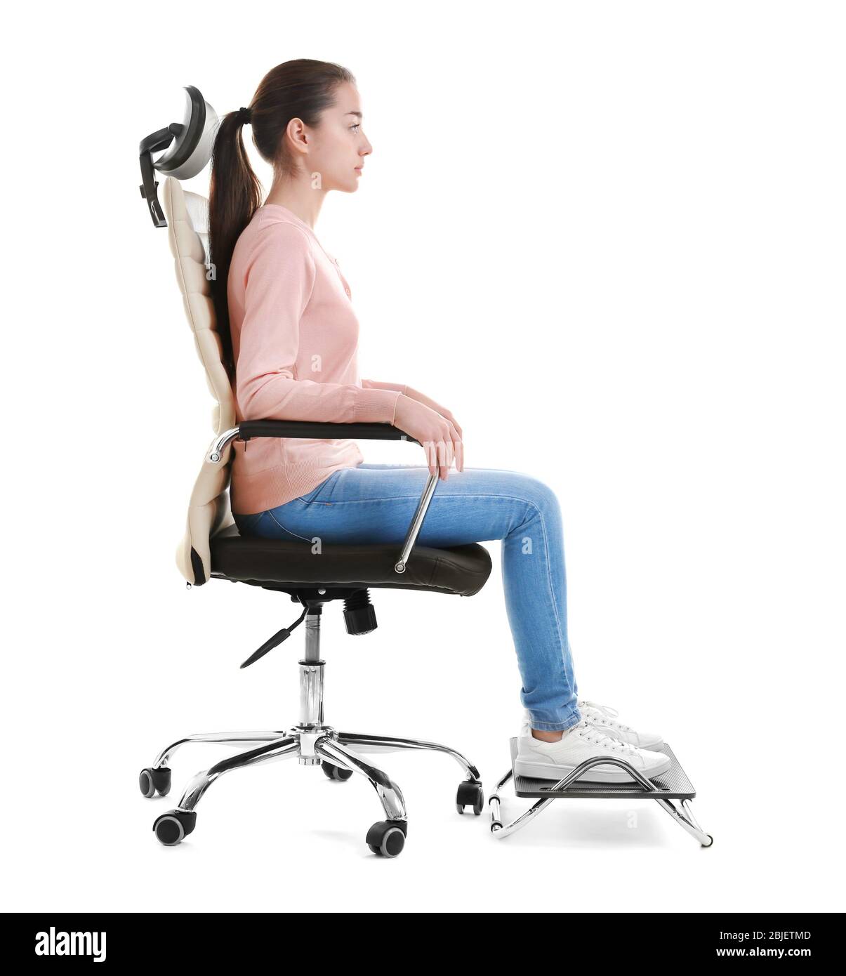 Posture concept. Young woman sitting in armchair against white ...