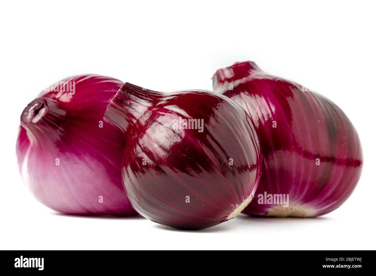 Red, purple onions isolated on white background Stock Photo - Alamy