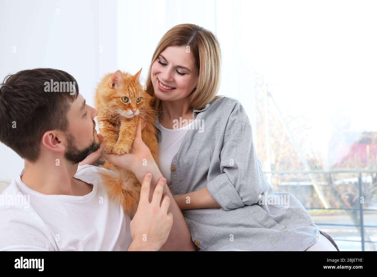 Portrait adorable couple cuddle hi-res stock photography and images - Alamy