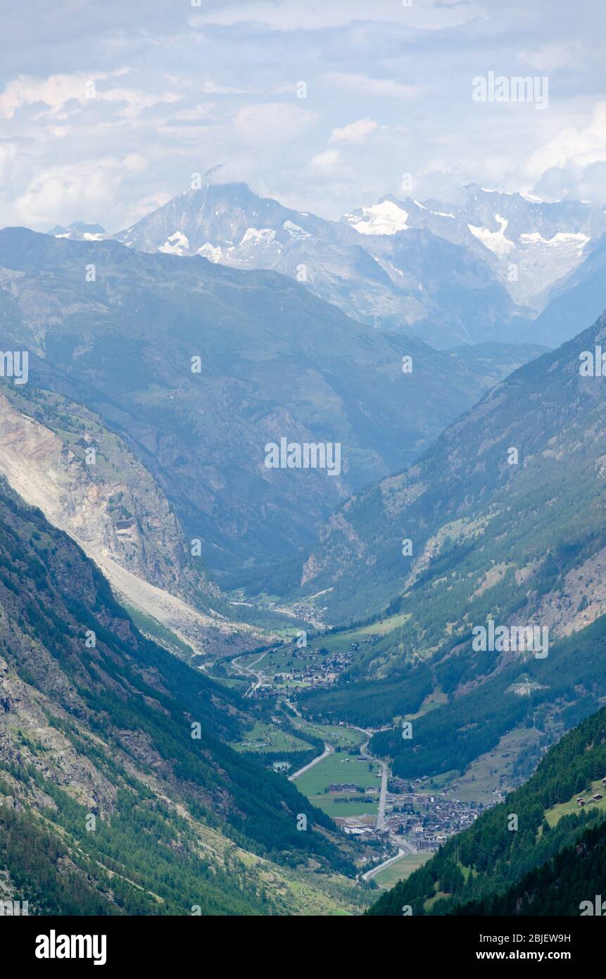 Mountainous landscape and the Matter Valley beneath as seen on a cloudy ...