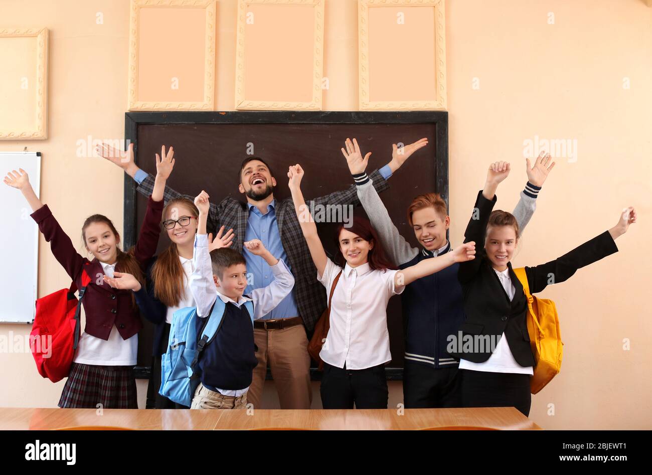 Middle school classroom hands up hi-res stock photography and images ...