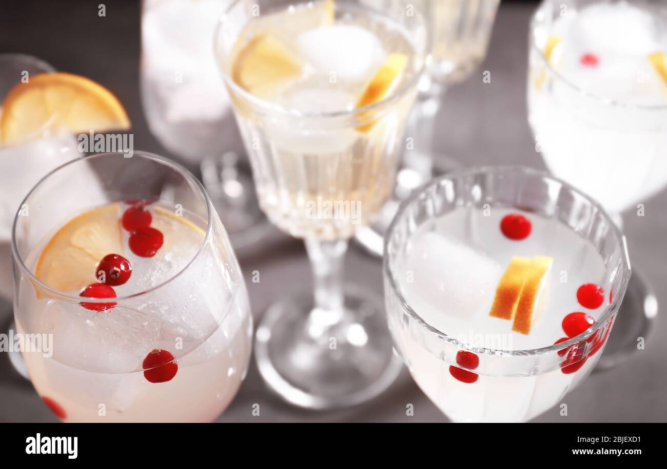 Different refreshing cocktails on table Stock Photo - Alamy