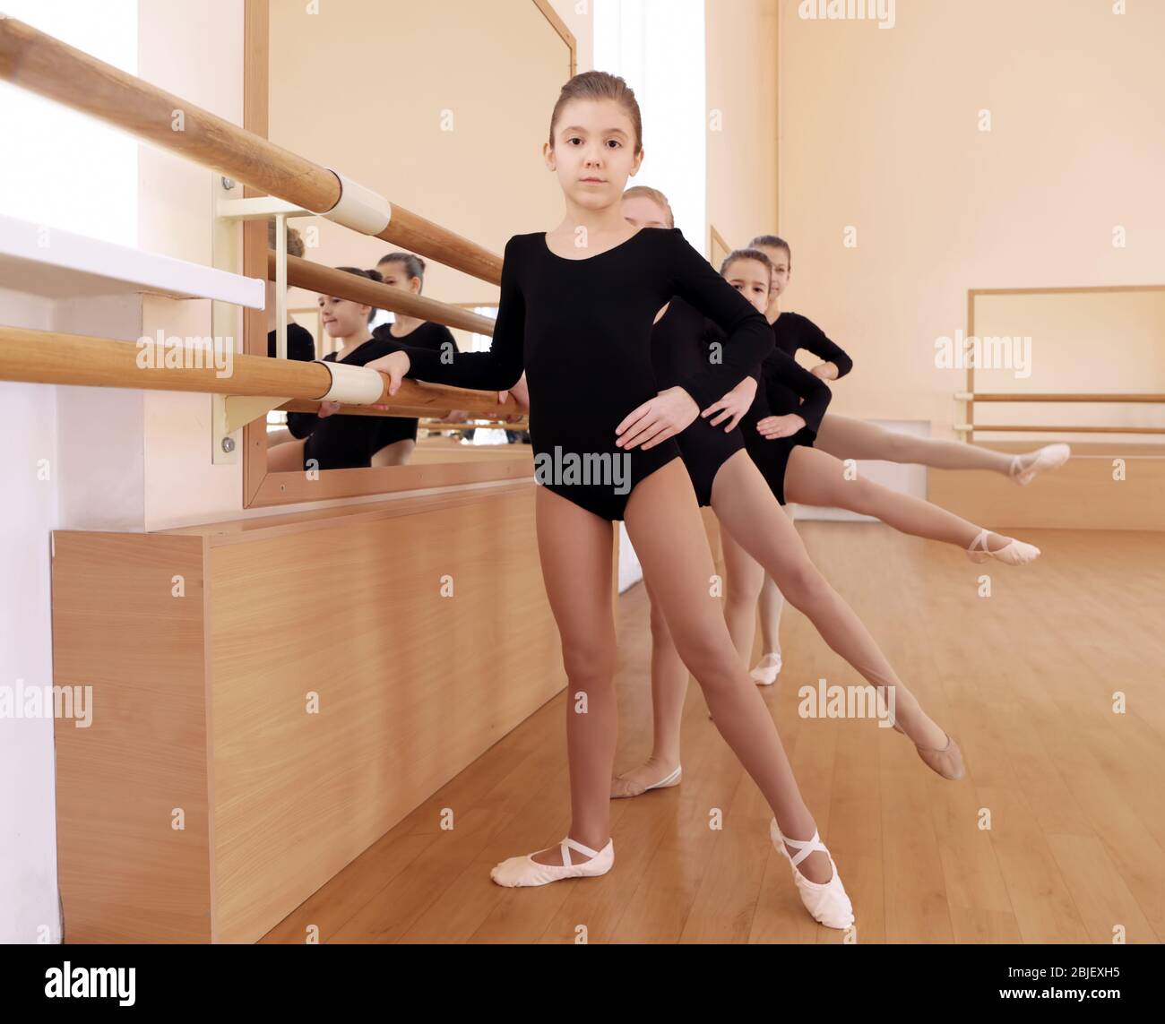 Cute little girls training in dance studio Stock Photo - Alamy