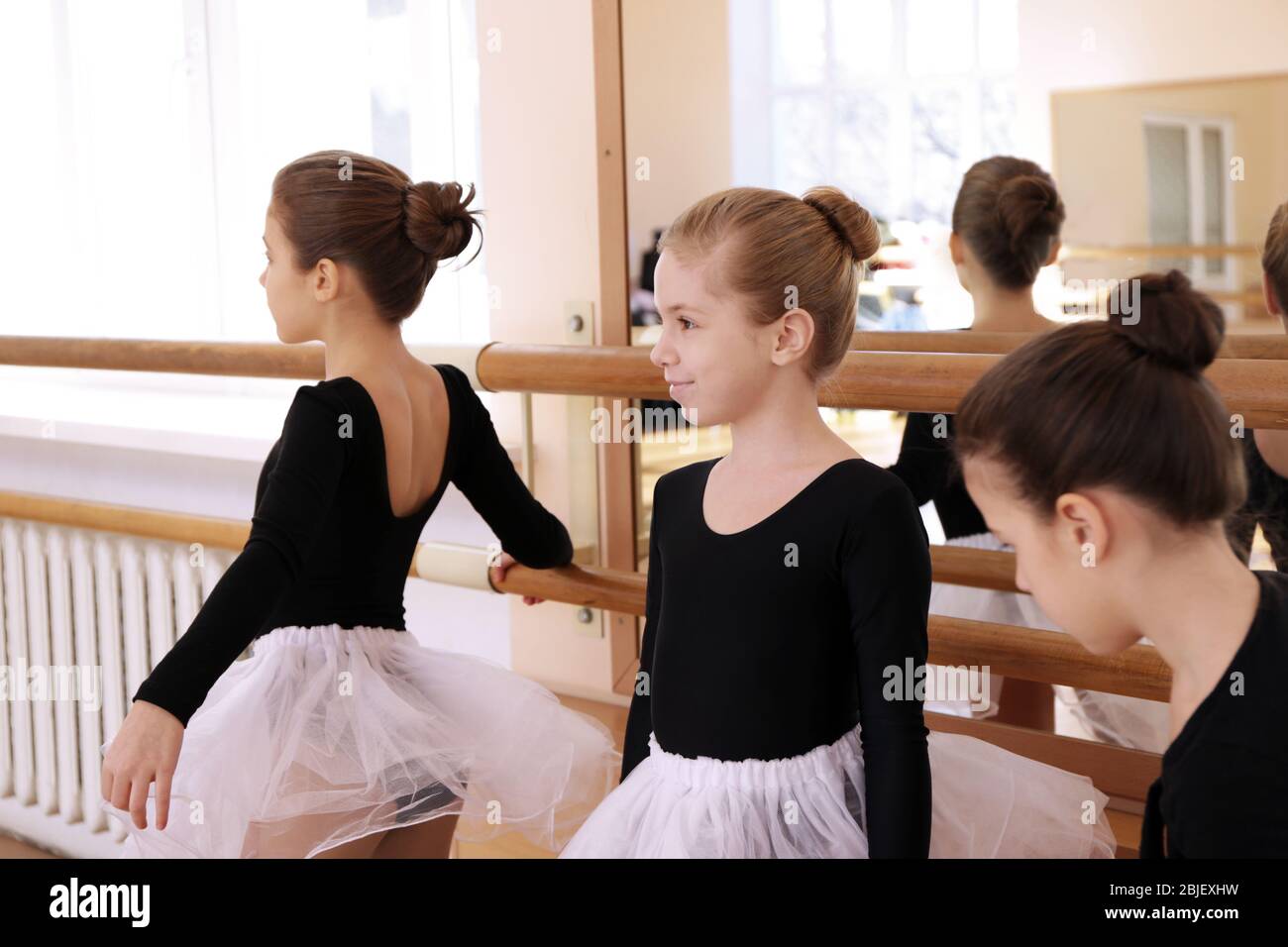 Cute little girls training in dance studio Stock Photo - Alamy