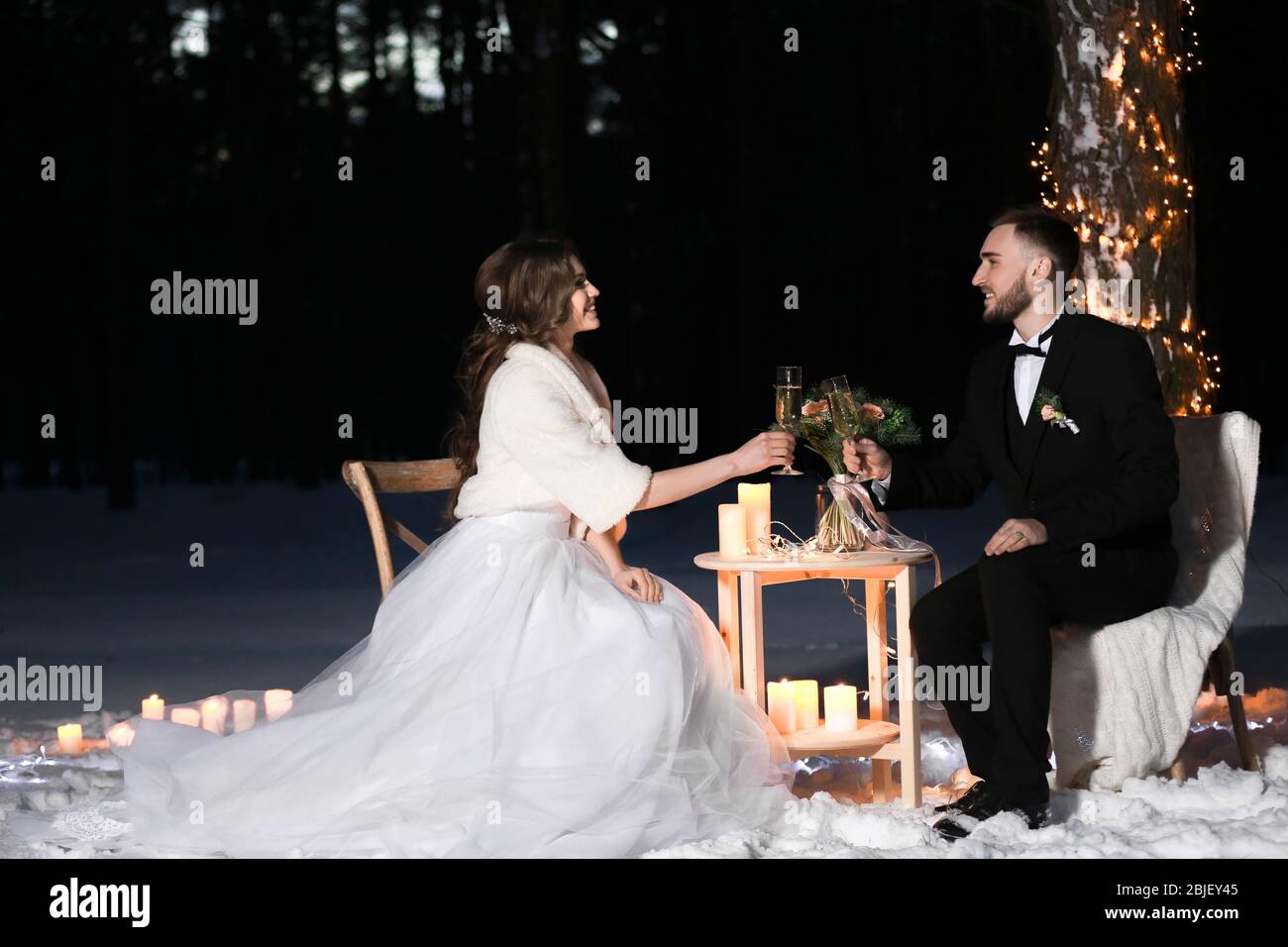 Beautiful winter wedding outdoors in evening Stock Photo - Alamy