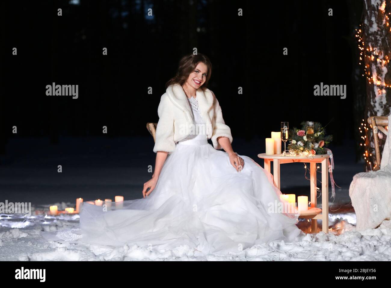 Beautiful bride outdoors on winter evening Stock Photo - Alamy