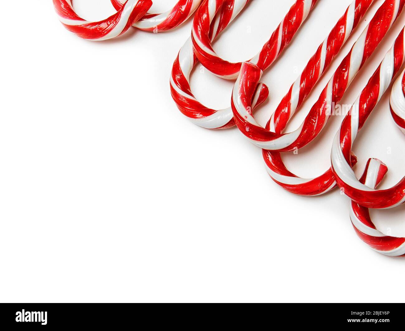 Candy canes on white background Stock Photo - Alamy