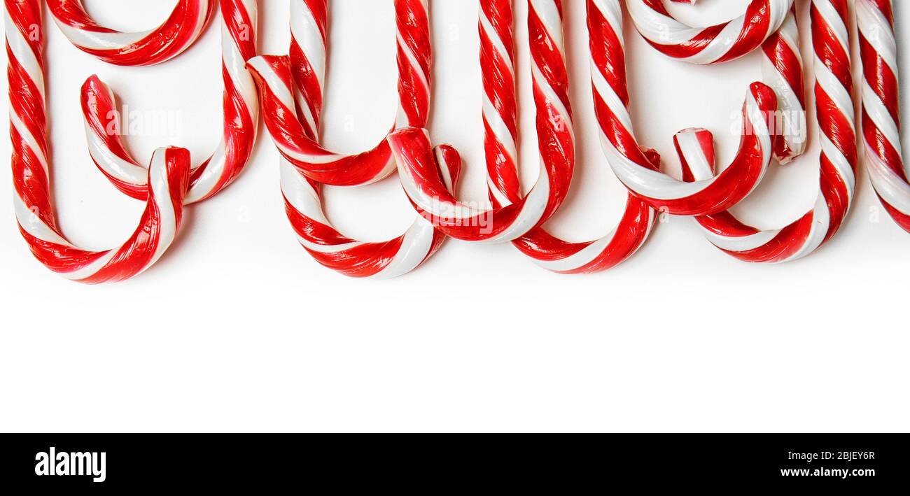 Candy canes on white background Stock Photo - Alamy