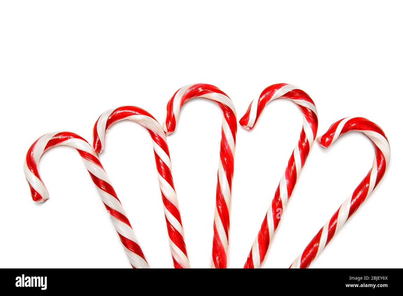 Candy canes on white background Stock Photo - Alamy