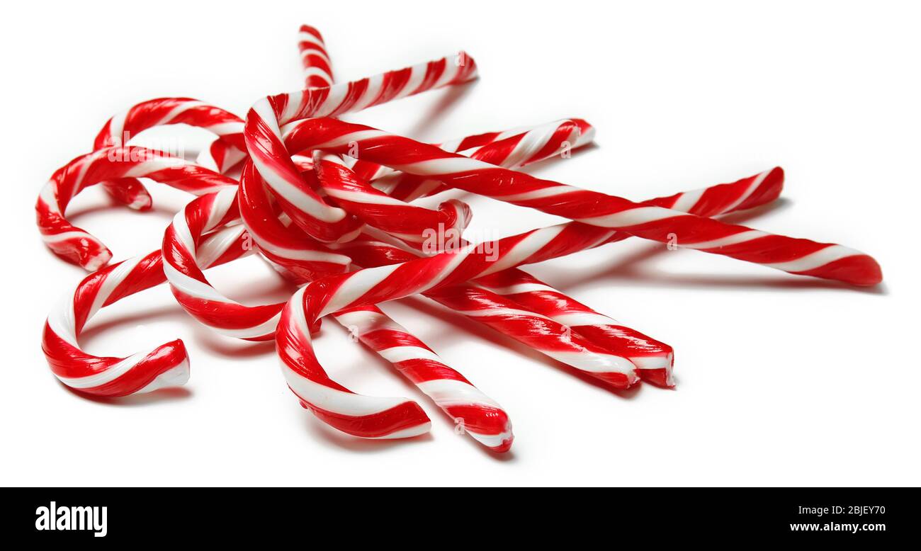 Candy canes on white background Stock Photo - Alamy