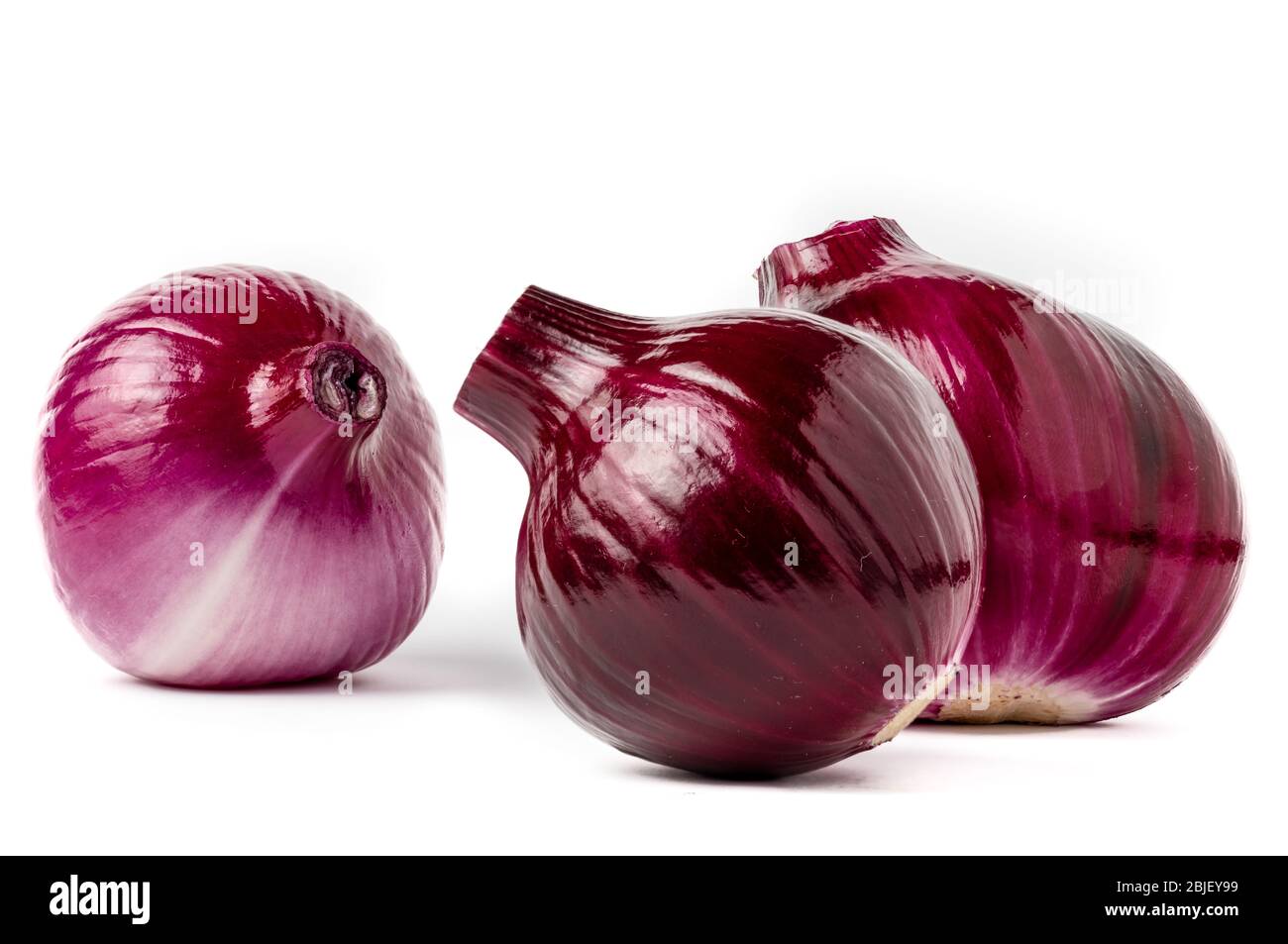 Red, purple onions isolated on white background Stock Photo - Alamy