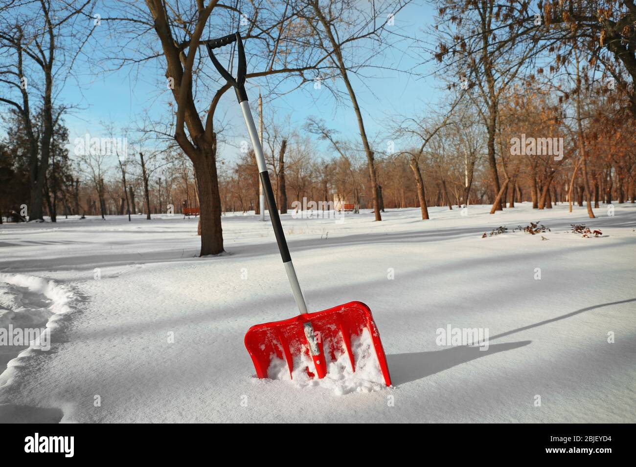 Red shovel for snow removal Stock Photo - Alamy