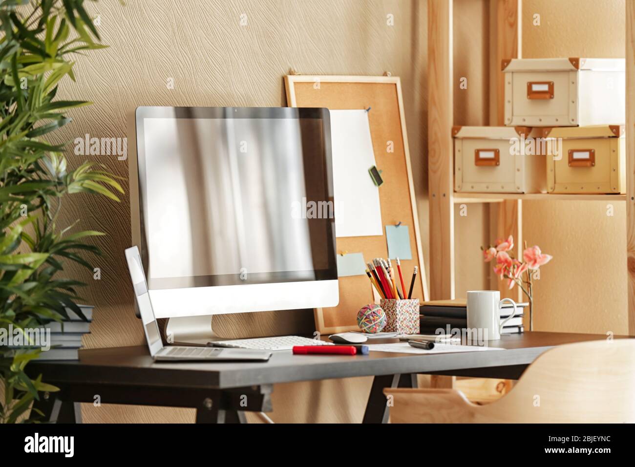 Modern design of workplace with big computer monitor Stock Photo - Alamy