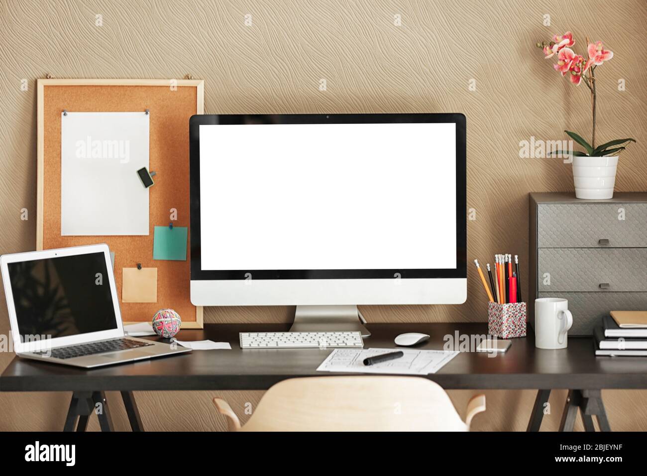 Modern design of workplace with big computer monitor Stock Photo - Alamy