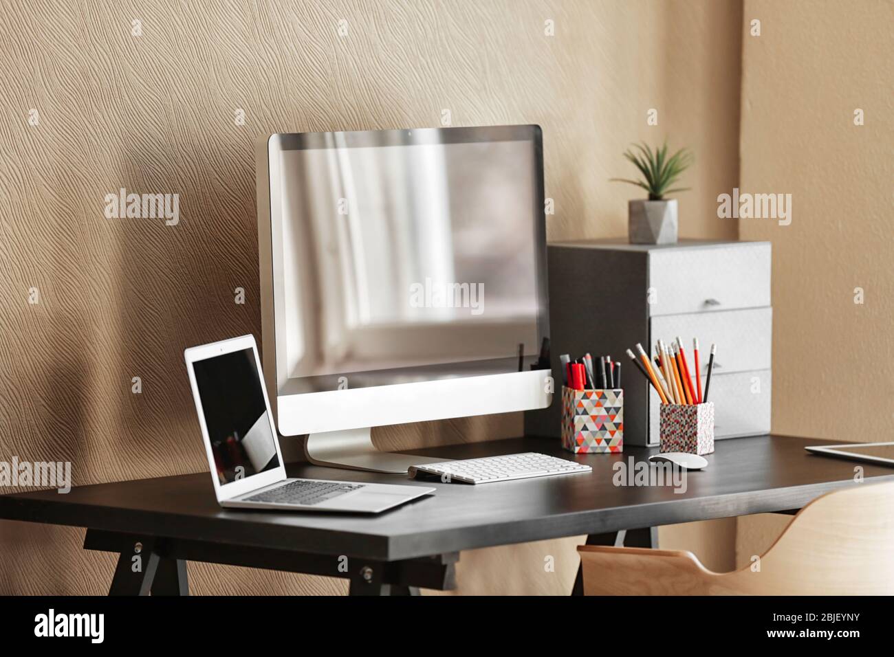 Modern design of workplace with big computer monitor Stock Photo - Alamy
