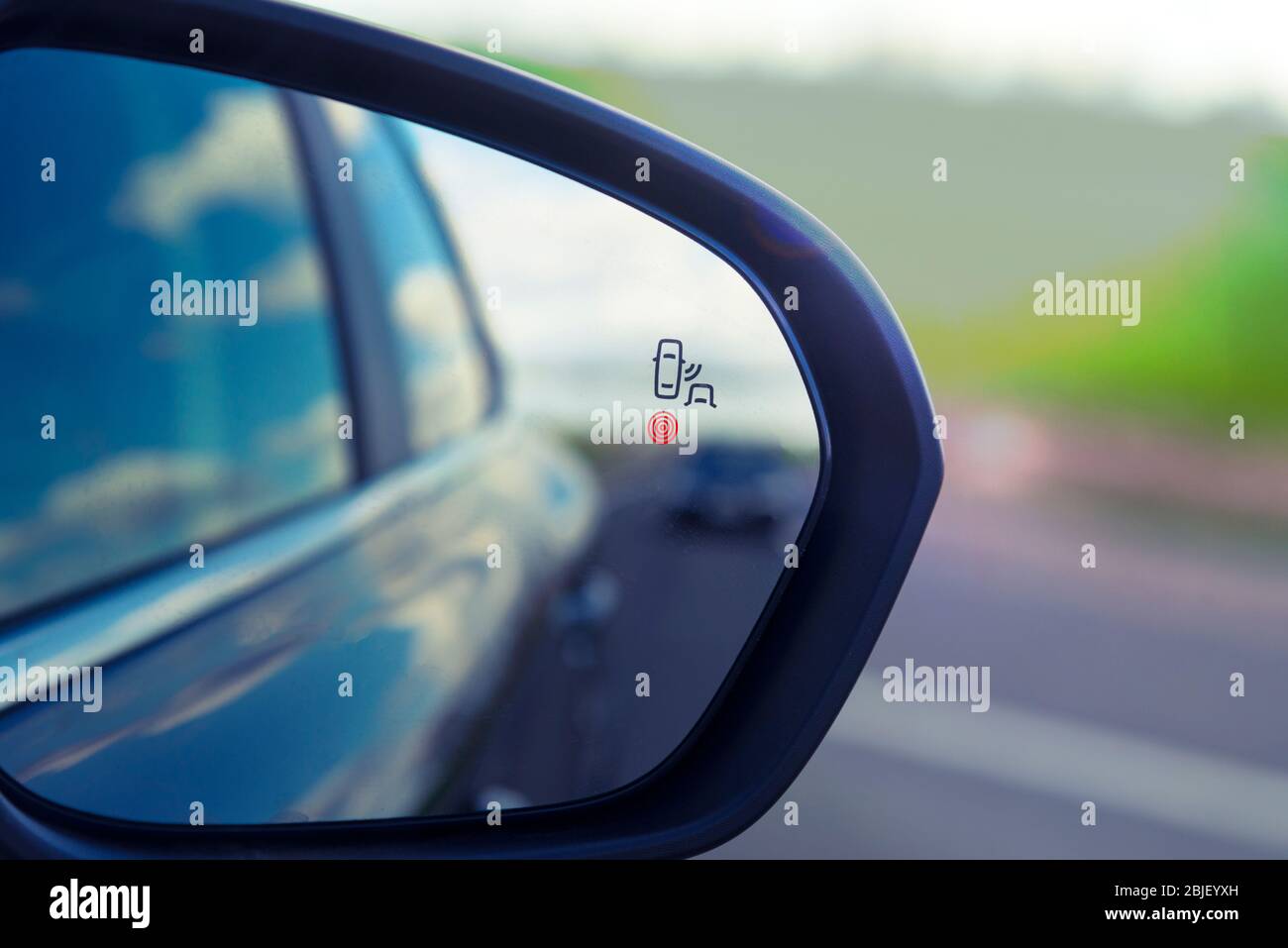 blind zone monitoring sensor on the side mirror of a modern car Stock ...