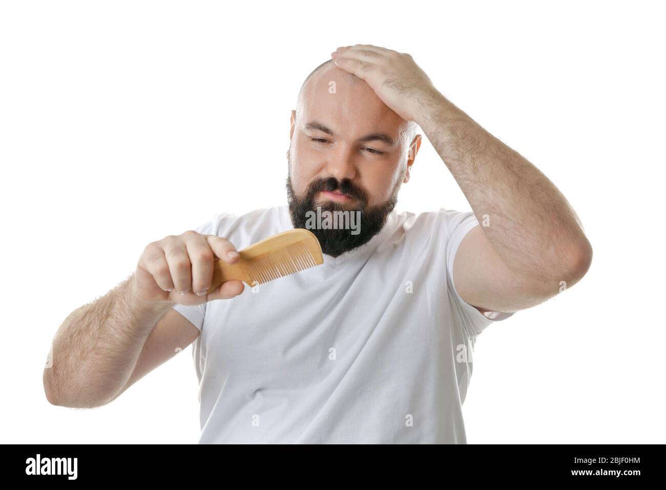 Bald adult man with comb on white background Stock Photo - Alamy
