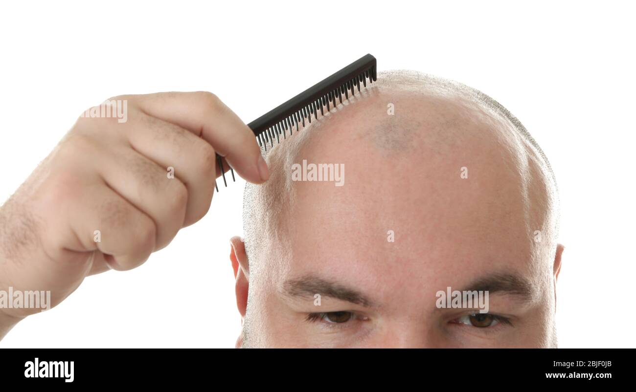 Bald adult man with comb on white background Stock Photo - Alamy