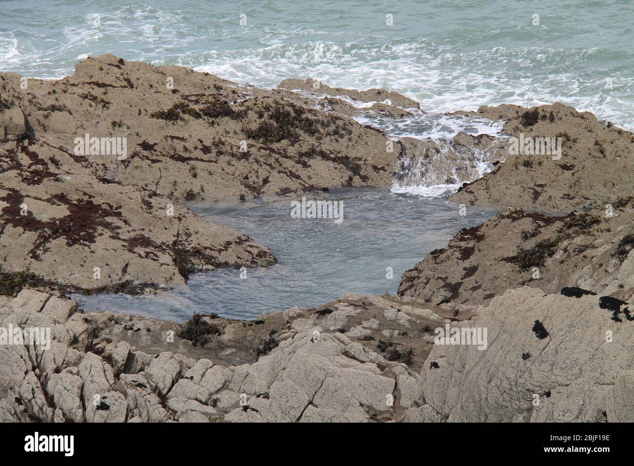 Sea Water Flowing into Coastal Rock Pool Stock Photo - Alamy
