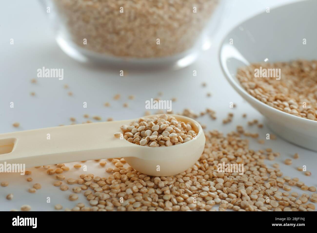 Organic quinoa seeds on white background Stock Photo - Alamy