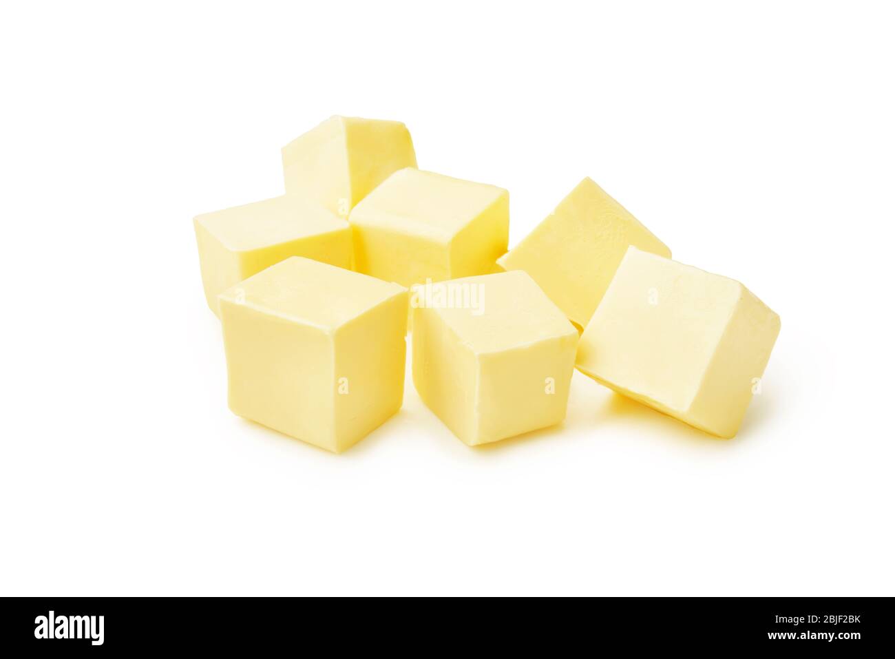 Pieces of butter isolated on white background. Butter cubes Stock Photo ...