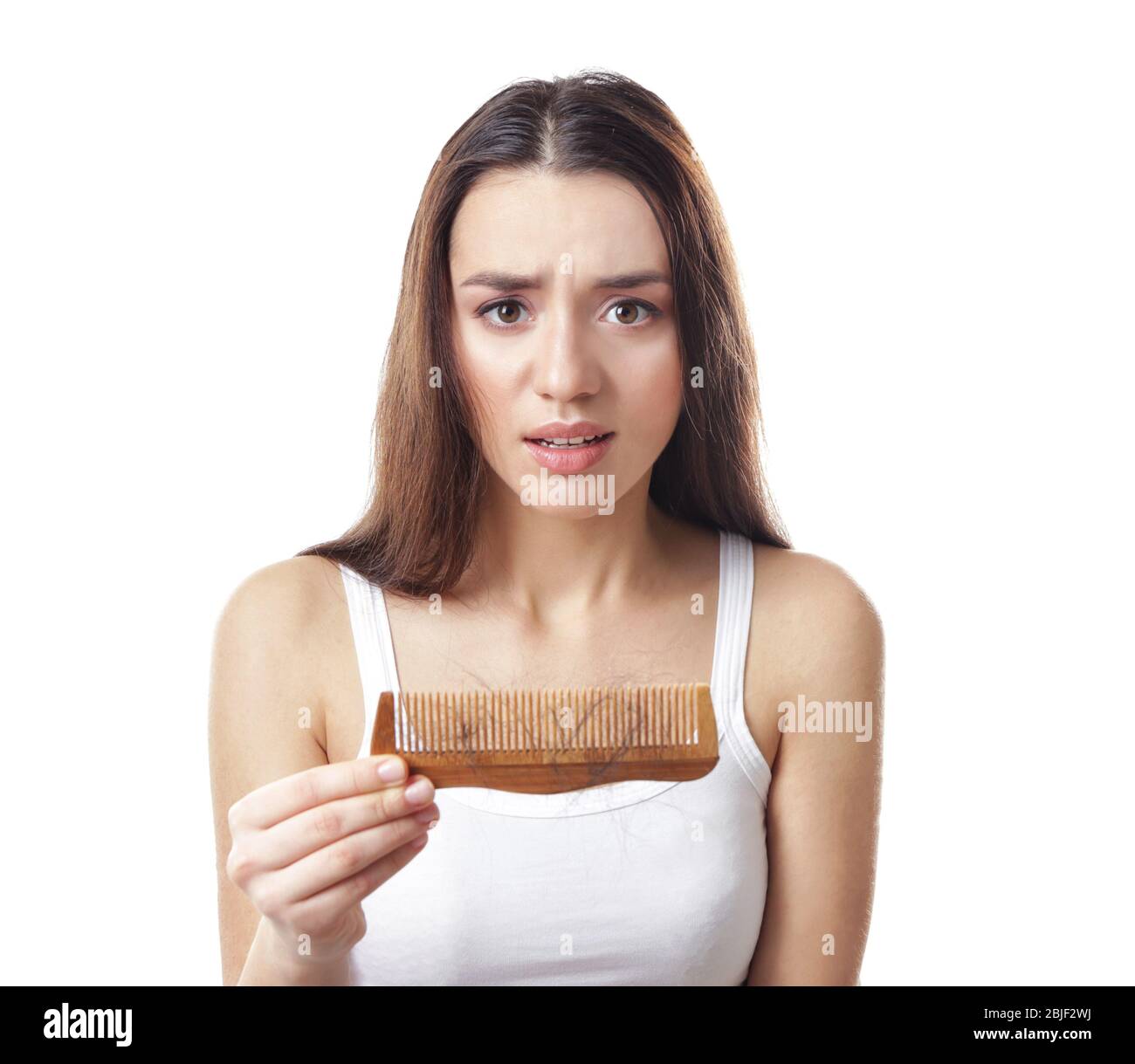 Young woman with hair loss problem on white background Stock Photo - Alamy