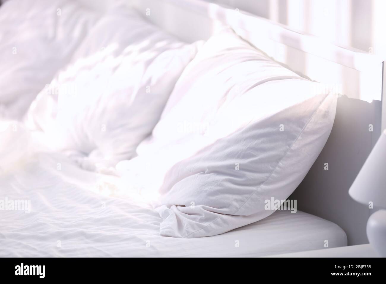 Closeup view of big cozy bed Stock Photo - Alamy