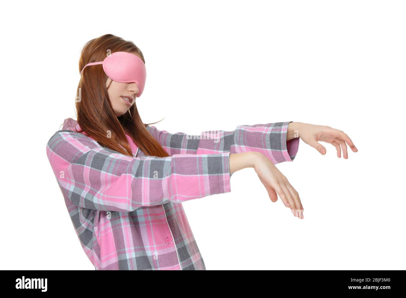 Young sleepy woman suffering from somnambulism on white background Stock Photo - Alamy